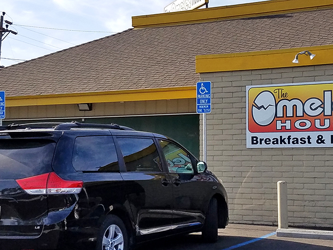 The unassuming yellow-trimmed exterior of The Omelet House might not scream "breakfast paradise," but locals know better than to judge this egg sanctuary by its shell.