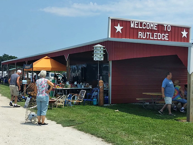 The iconic red "Welcome to Rutledge" sign stands as a beacon to bargain hunters, promising adventures in antiquing that Instagram filters simply can't replicate.