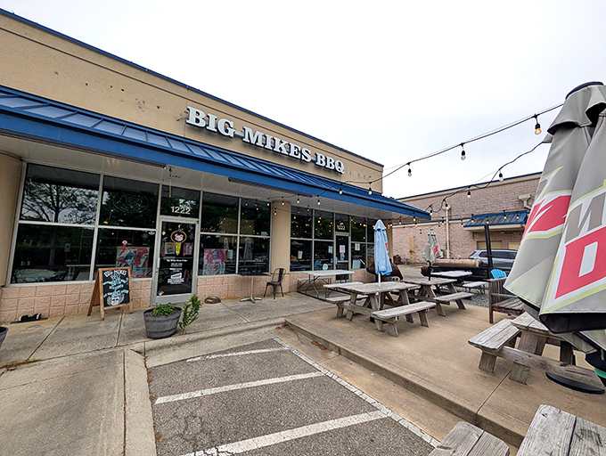 Blue awnings and picnic tables welcome you to this unassuming strip mall treasure where smoke signals announce serious barbecue business is happening inside.