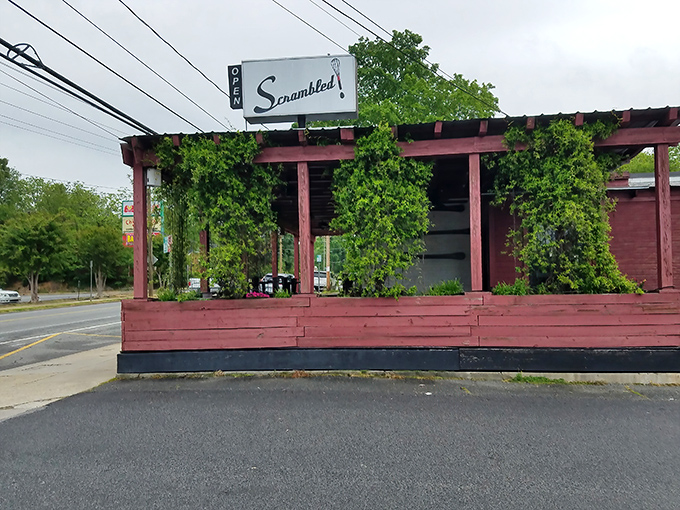The vine-draped porch of Scrambled welcomes you like a Southern grandmother's hug—rustic, charming, and promising something delicious inside.