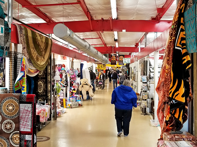 The main corridor stretches like a retail yellow brick road, promising treasures at every turn. Shoppers stroll beneath red beams, hunting for their next great find.