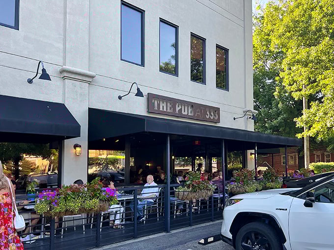 The welcoming facade of The Pub at 333 in Oakmont, with seasonal corn stalks and flowers creating that "come on in" vibe every neighborhood gem should have.