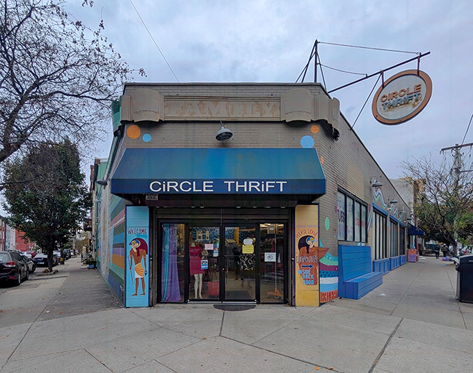 The iconic blue awning of Circle Thrift glows like a beacon for treasure hunters as dusk settles over Philadelphia, promising adventures in secondhand splendor.