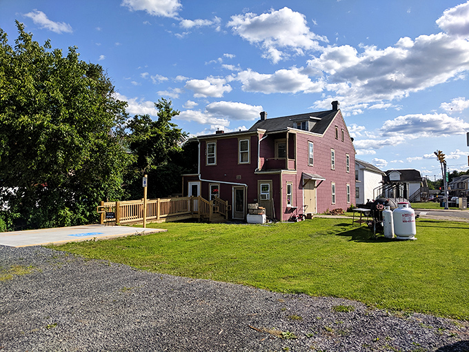 The burgundy-colored house doesn't scream "barbecue destination" until that first whiff of smoke hits your nose. Culinary magic happens in unexpected places.