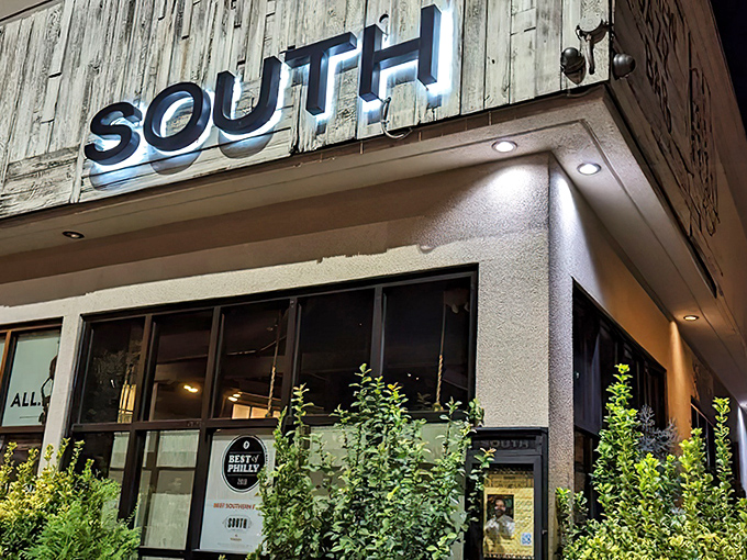 SOUTH's exterior speaks volumes with its rustic wooden signage&mdash;"KITCHEN, JAZZ, BAR"&mdash;like a delicious haiku promising good times ahead.