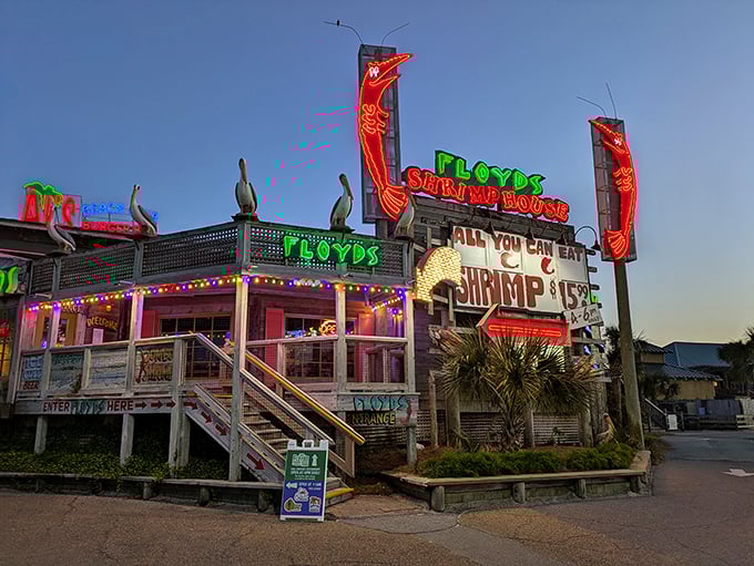 The neon-lit exterior of Floyd's Shrimp House glows like a beacon for hungry seafood lovers, promising all-you-can-eat treasures from the Gulf.
