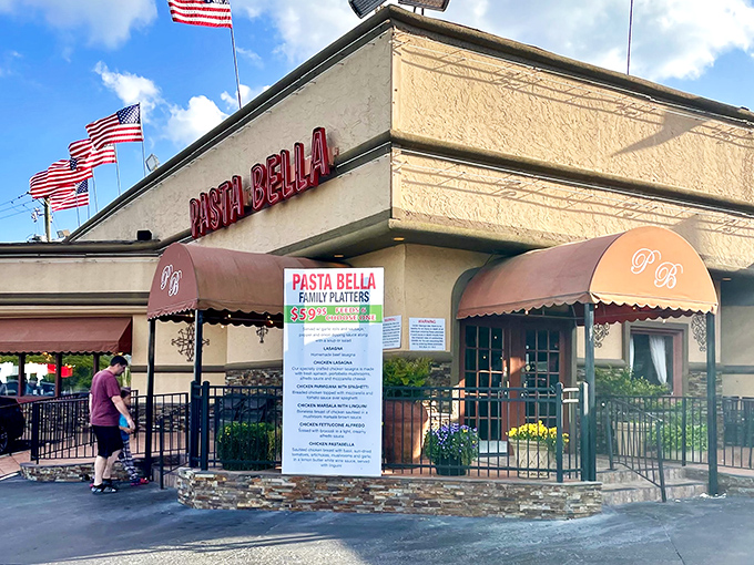 The coral-colored exterior with bold red signage promises Italian comfort without pretension. Like a beacon of carb-laden joy in suburban Marietta.