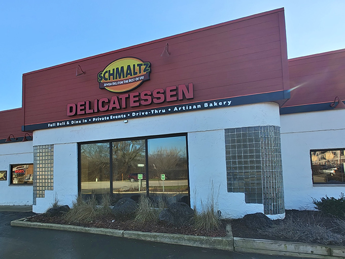 The bright red facade of Schmaltz Delicatessen stands out like a beacon of hope for bagel lovers in the suburban wilderness of Lisle.
