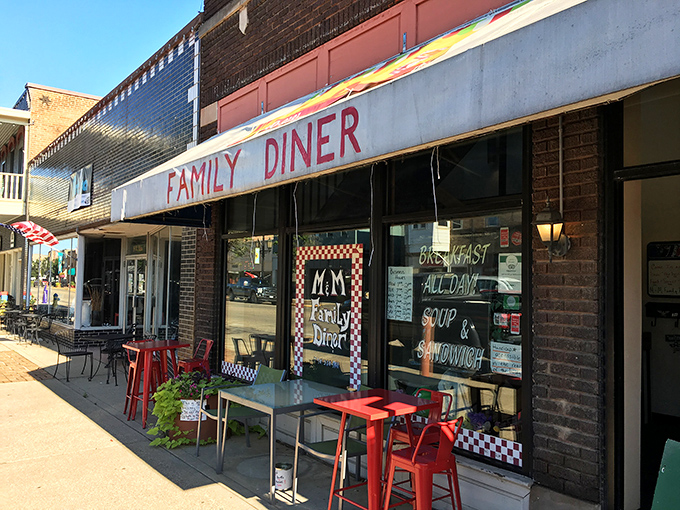 The unassuming storefront of M & M Family Diner beckons hungry travelers with its classic white awning and red lettering&mdash;proof that culinary treasures often hide in plain sight.