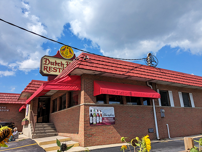 The iconic red-roofed Dutch Kitchen stands proudly along I-81, its vintage sign beckoning hungry travelers like a lighthouse for comfort food enthusiasts.