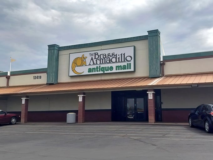 The unassuming exterior hides a universe of treasures within. Like a time-travel portal disguised as a strip mall storefront, the Brass Armadillo beckons.