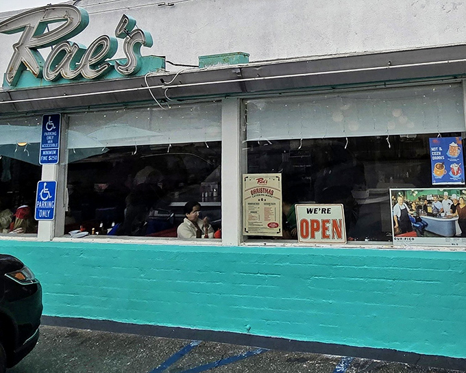 That iconic turquoise exterior isn't just a color choice&mdash;it's a time machine disguised as a diner. Welcome to Rae's, where nostalgia comes served with every meal.