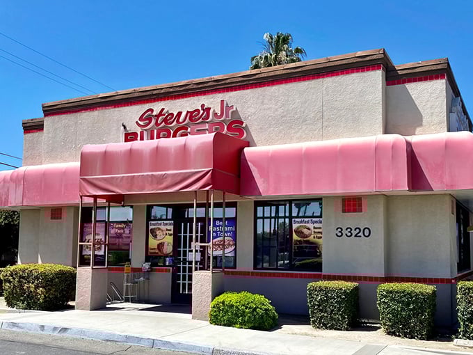 Steve's Jr Burgers stands proud with its cherry-red awnings, like a beacon of hope for hungry travelers. California sunshine bounces off this unassuming temple of taste.