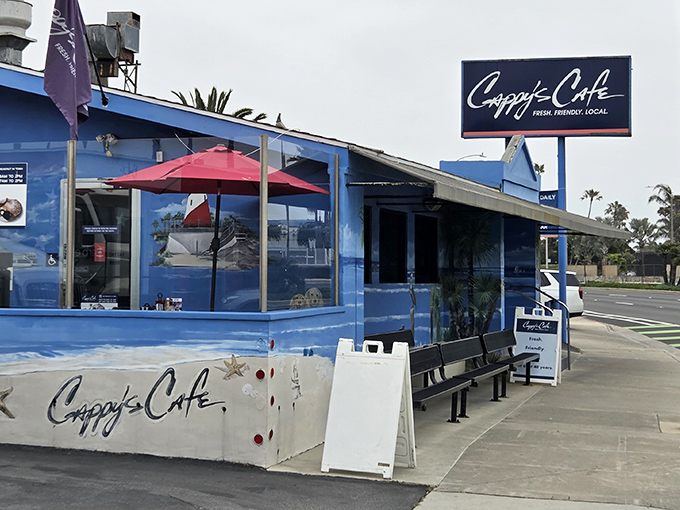 The iconic blue exterior of Cappy's Caf&eacute; stands out like a beacon of breakfast hope on Newport Beach's coastline.