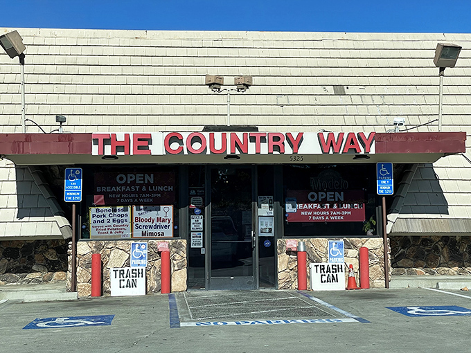The unassuming exterior of The Country Way might not scream "culinary destination," but locals know those red trash cans guard a breakfast paradise worth finding.