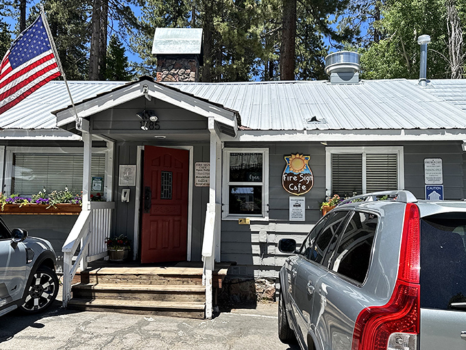 The unassuming exterior of Fire Sign Caf&eacute; stands like a breakfast speakeasy among Tahoe pines, its red door a portal to pancake paradise.