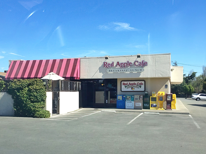 The unassuming exterior of Red Apple Cafe proves once again that culinary treasures often hide behind modest fa&ccedil;ades. That red-striped awning is basically a superhero cape for breakfast lovers.