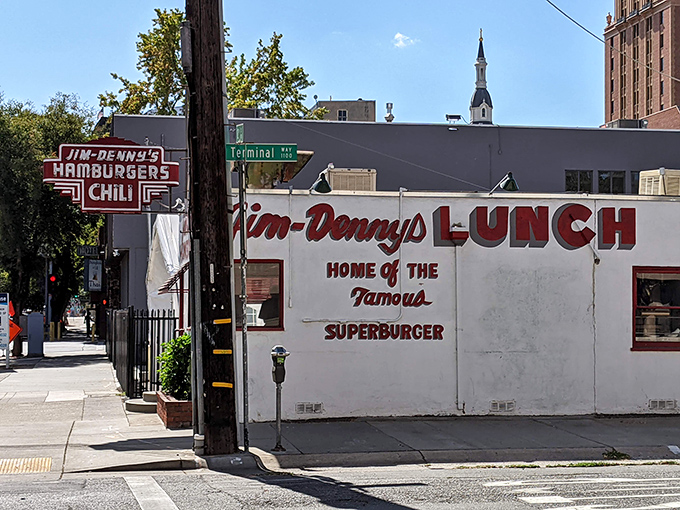 The iconic Jim Denny's sign beckons hungry travelers like a neon lighthouse in a sea of chain restaurants. Sacramento's little diner with big flavor.