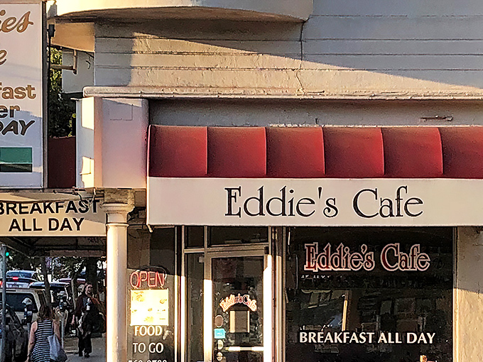 The iconic red-cushioned exterior of Eddie's Caf&eacute; promises breakfast salvation, standing like a beacon for hungry San Franciscans on Divisadero Street.