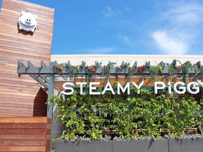 Steamy Piggy's exterior combines modern architecture with playful charm. That smiling piggy logo isn't just cute&mdash;it's a beacon calling hungry souls to dumpling paradise.