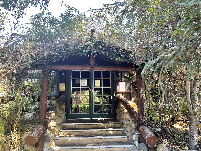 The entrance to Saddle Peak Lodge feels like stepping into a mountain retreat that time forgot. Rustic charm with California cool.