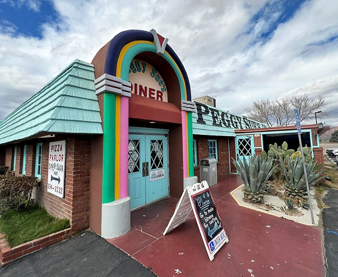 That rainbow-arched entrance isn't just a doorway&mdash;it's a time portal to an era when Elvis was king and milkshakes came with the metal mixing cup.