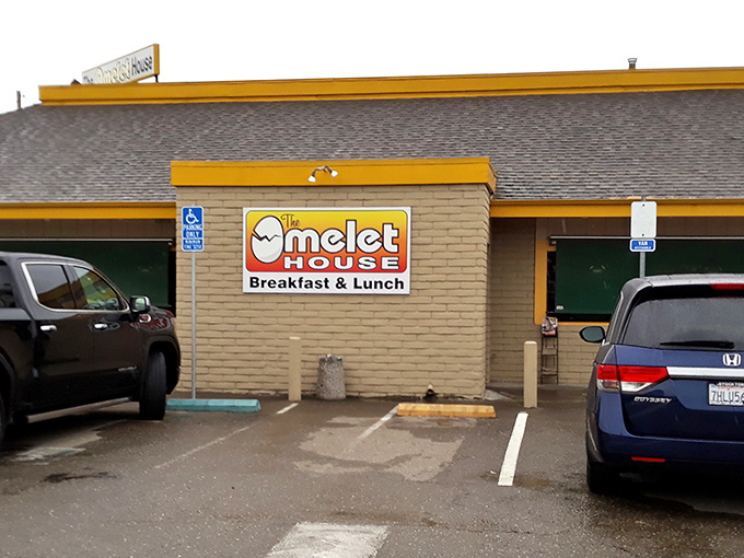 The bright yellow trim of Omelet House beckons like a breakfast lighthouse in Stockton, promising eggy treasures within those humble walls.