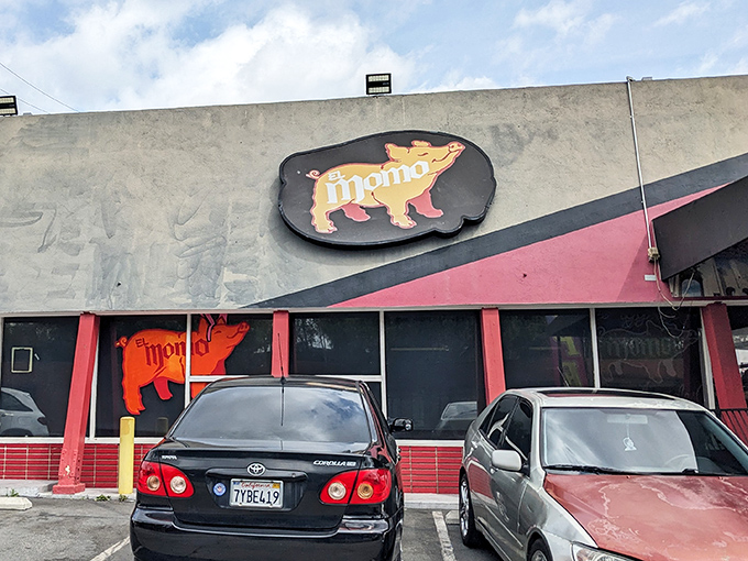 The iconic yellow pig logo beckons hungry travelers like a porcine North Star, guiding carnitas pilgrims to their delicious destination.