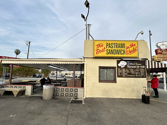 The iconic yellow sign promises "The Best Pastrami Sandwich in the World" &ndash; a bold claim The Hat has been backing up for decades.