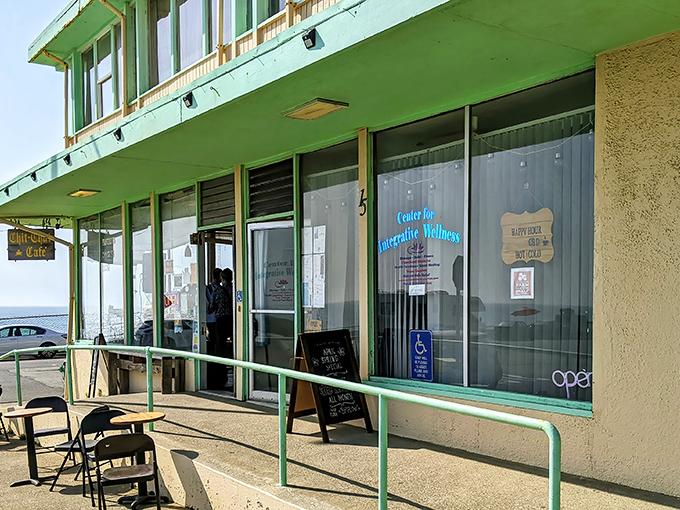 The mint-green facade of Chit Chat Cafe stands like a sentry at the edge of the Pacific, promising simple pleasures and ocean views that million-dollar restaurants can't buy.