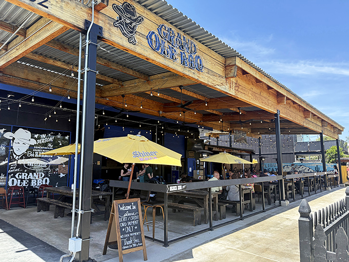 Welcome to barbecue paradise! Grand Ole BBQ's rustic wooden exterior and picnic tables promise the kind of no-frills experience where the food does all the talking.