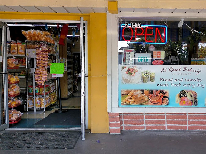 The unassuming storefront of El Rosal Bakery beckons with its blue-tiled roof and bright red sign&mdash;proof that culinary treasures often hide in plain sight.