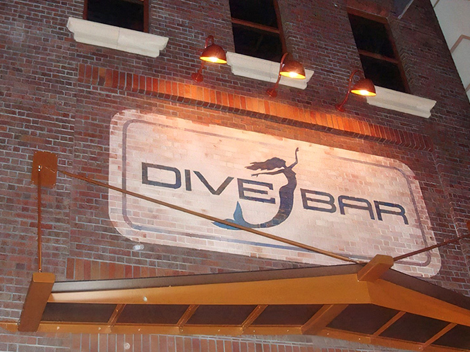 The brick facade of Dive Bar beckons with its illuminated mermaid logo &ndash; Sacramento's answer to "what if Ariel opened a cocktail lounge?"