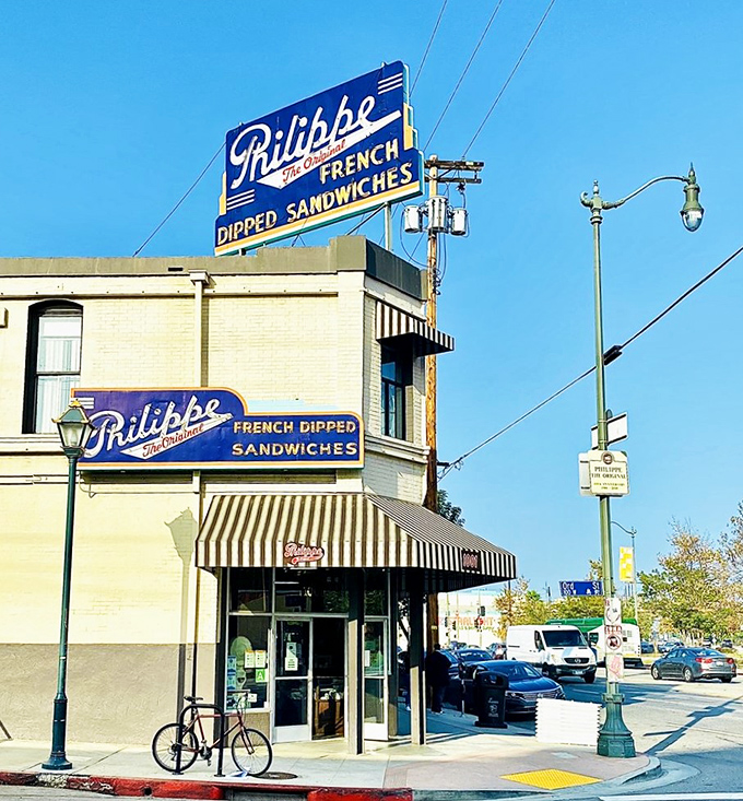 The iconic blue and yellow signage of Philippe's stands as a beacon for sandwich lovers, a landmark that's been drawing Angelenos for generations.