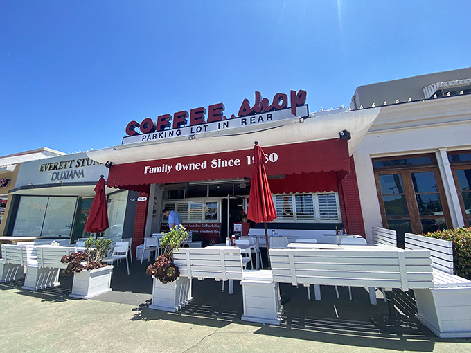 That red awning beckons like a lighthouse for hungry souls seeking authentic diner magic in La Jolla.