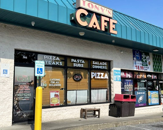 Tony's Cafe's unassuming storefront is like that friend who doesn't brag but always delivers. The teal-topped sign has guided hungry Newark locals to pizza paradise for generations.