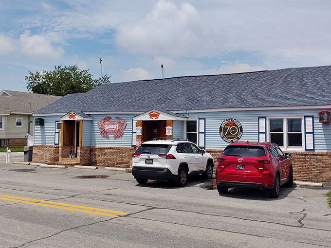 The iconic red crab sign against blue clapboard isn't just decoration&mdash;it's a beacon of deliciousness calling to hungry seafood lovers across Delaware.