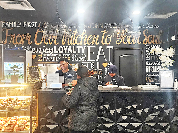 The welcoming counter at Aunt Vonda's features a stunning black wall with golden script that promises to feed both body and soul.
