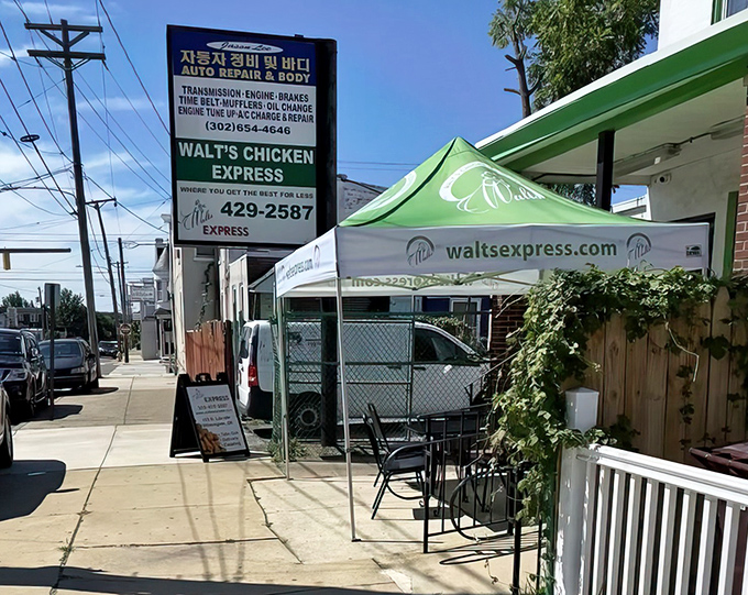 The iconic green and white exterior of Walt's Flavor Crisp Chicken Express stands as a beacon of fried chicken perfection in Wilmington.