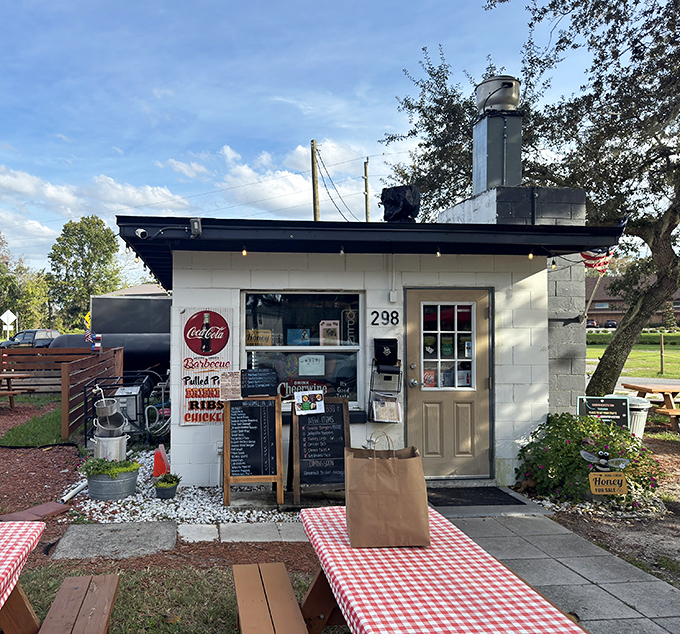 The unassuming white shack with twin smoker chimneys stands like a barbecue beacon in Oviedo. Yellow mums and a wooden ramp welcome meat pilgrims to BBQ paradise.