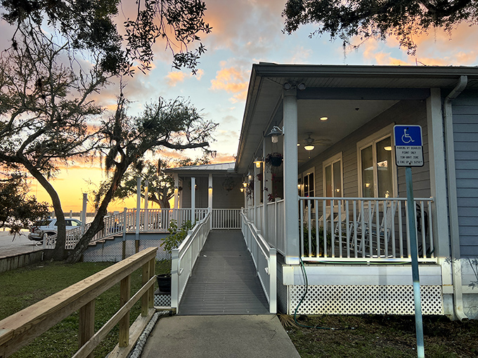 Sunset welcomes you to Aunt Kate's with a golden glow, where weathered oaks and waterfront views set the stage for seafood magic. 
