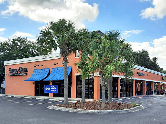 The orange exterior might not scream "culinary destination," but that glowing sign is like a lighthouse guiding hungry seafood lovers to shore. 