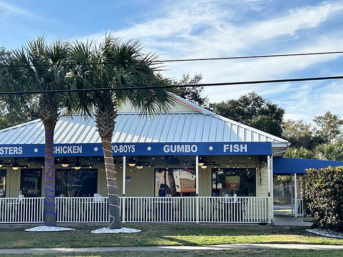 The blue awnings of Shrimp Basket beckon like a seafood siren call, promising oysters, chicken, po-boys, gumbo, and fish under one cheerful roof.