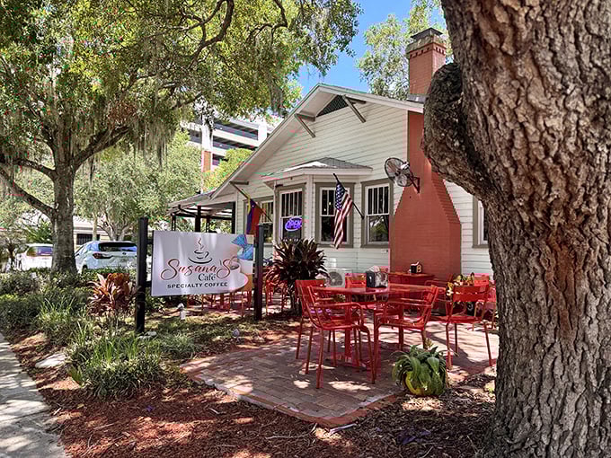 A charming white cottage with vibrant red outdoor seating, Susana's Cafe looks like it was plucked from a storybook and dropped under Florida's magnificent oak trees.