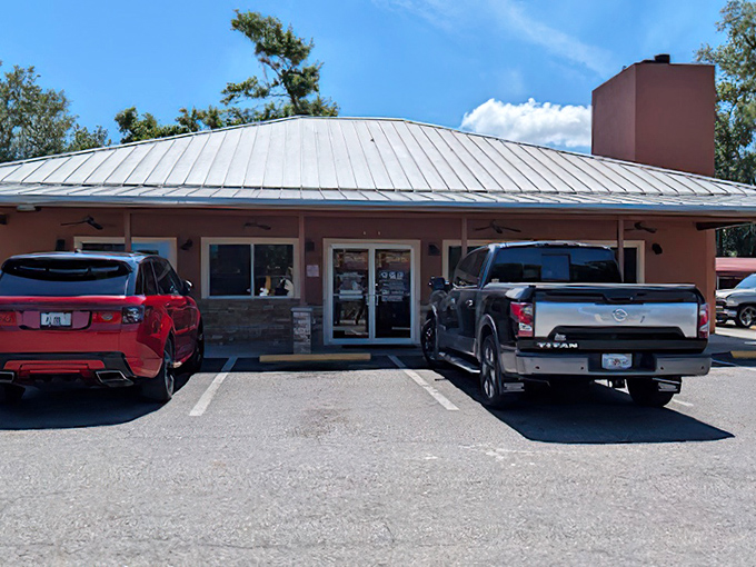 The unassuming pink building with its metal roof might not scream "barbecue paradise," but your nose will know better before you even park.