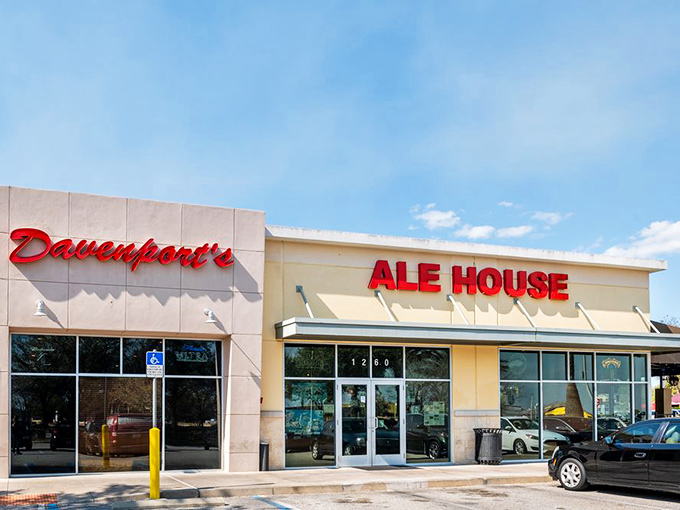 Davenport's welcoming exterior beckons with its bright red signage and inviting patio—the perfect spot to escape Florida's theme park madness.
