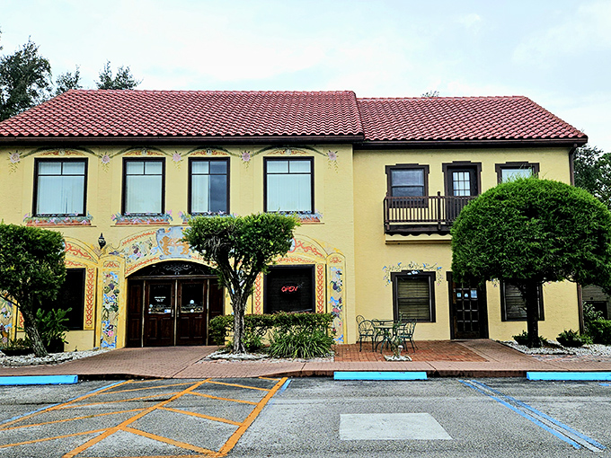 The sunshine-yellow facade of Yalaha Bakery stands like a cheerful postcard from Bavaria that somehow landed in Central Florida's lush landscape.