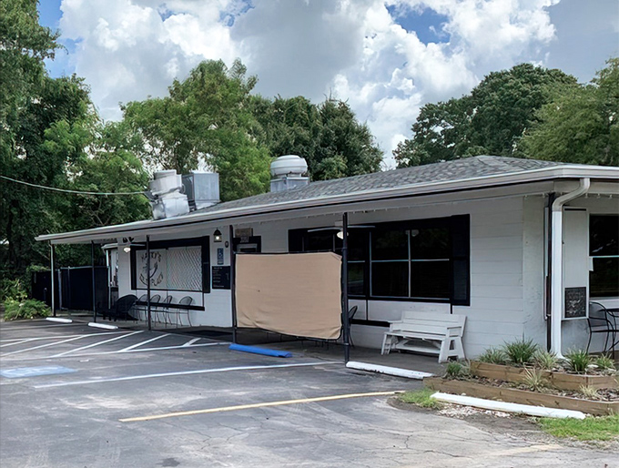 The unassuming yellow exterior of Harry's Old Place proves once again that in Florida, the most magical seafood experiences often hide in plain sight.
