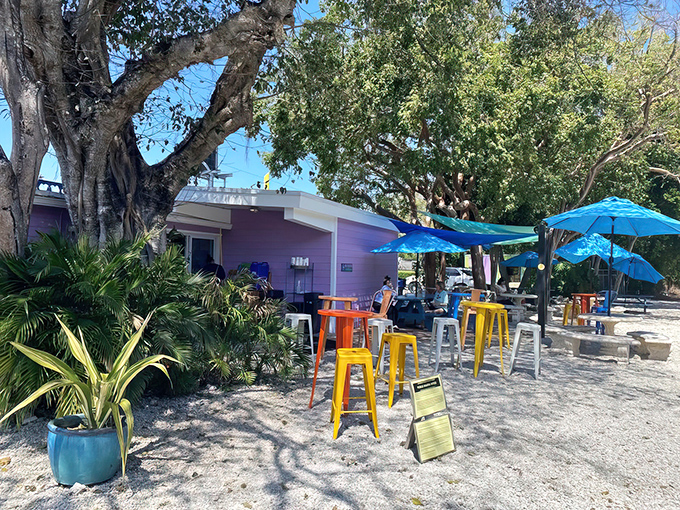The sunshine-yellow exterior with its purple sign isn't just eye-catching&mdash;it's practically screaming "vacation mode activated" to everyone driving by.