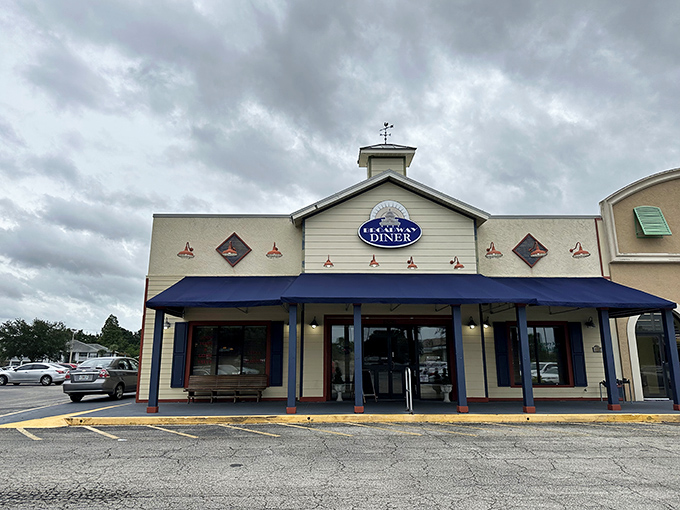 The welcoming facade of Broadway Diner in Bartow beckons with its classic blue awning and warm lighting&mdash;like a culinary lighthouse for hungry travelers.